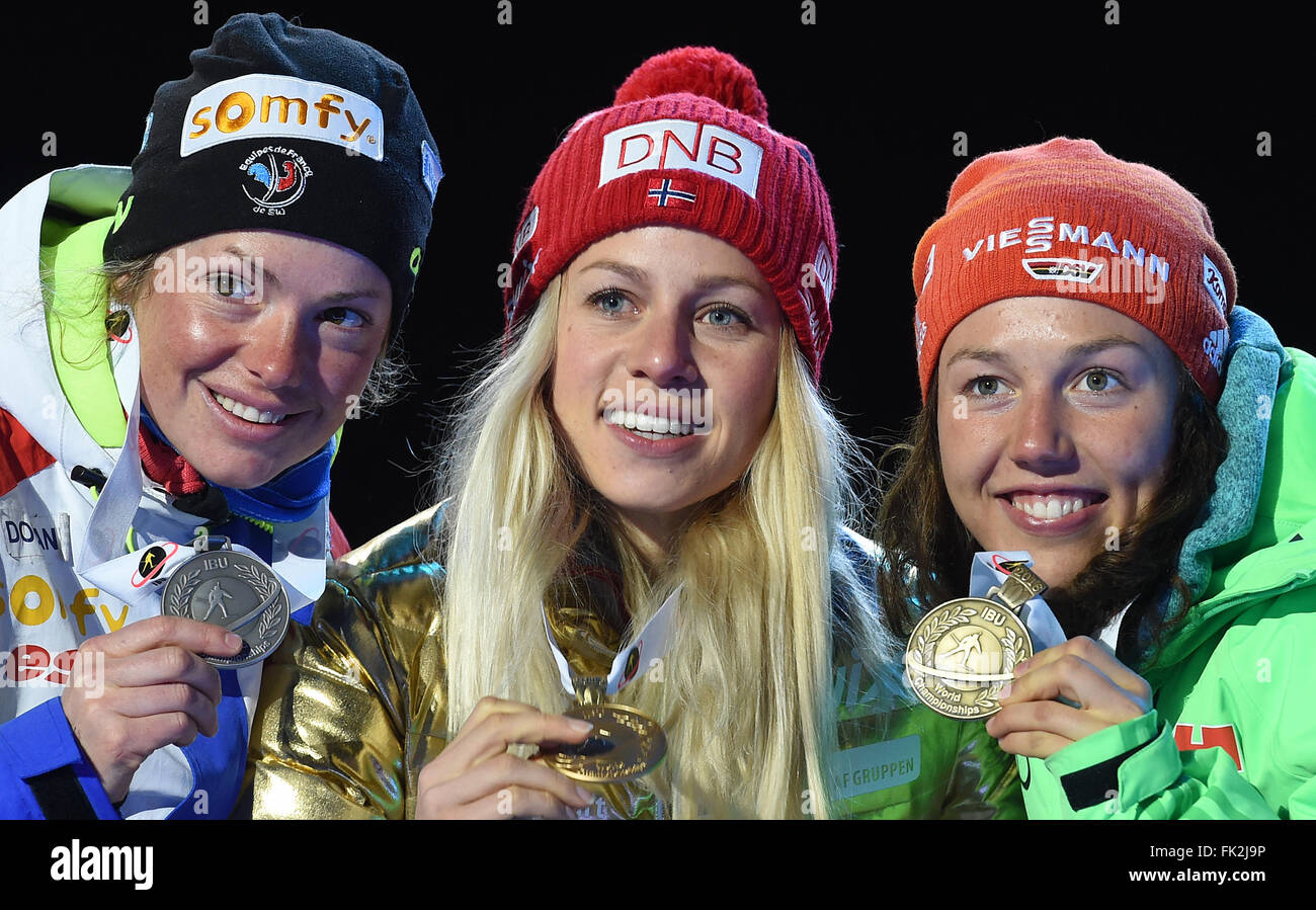 Gold medal winner Tiril Eckhoff of Norway (C) is flanked on the podium ...