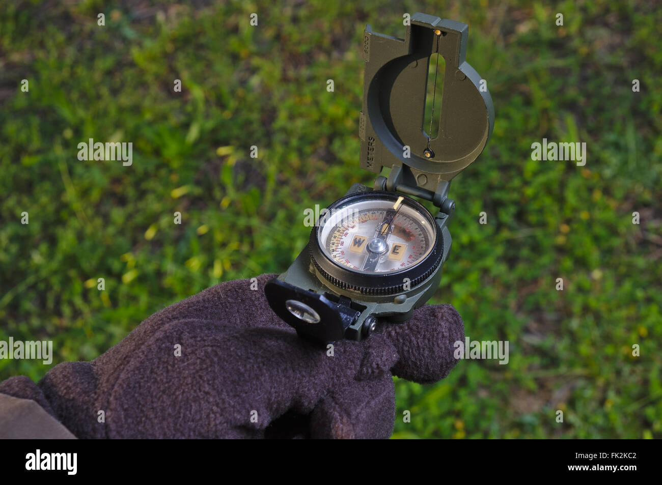 Handling a military compass. Survival, outdoors and military theme ...