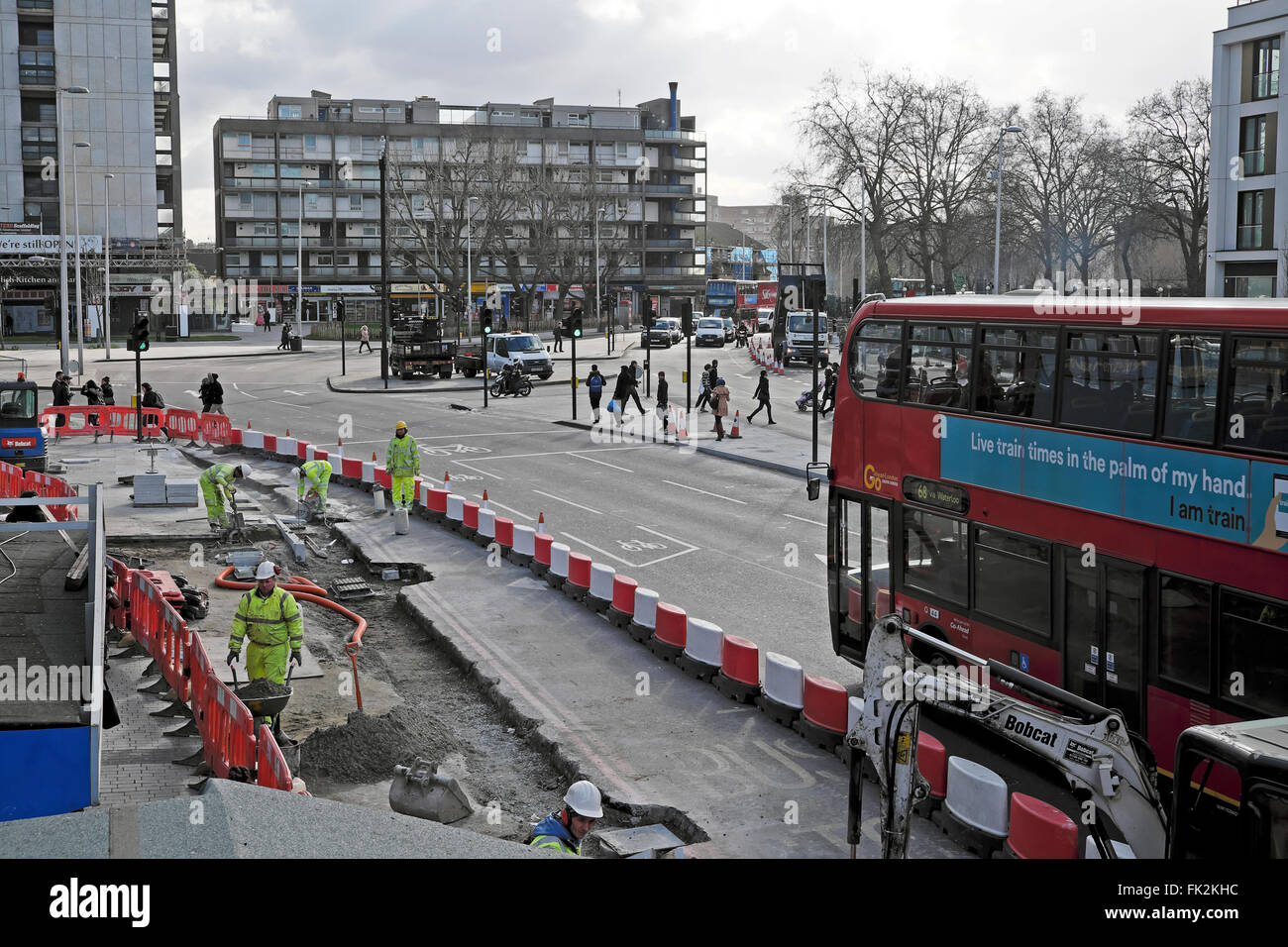 Roadworks men working at Elephant and Castle in London UK KATHY DEWITT ...