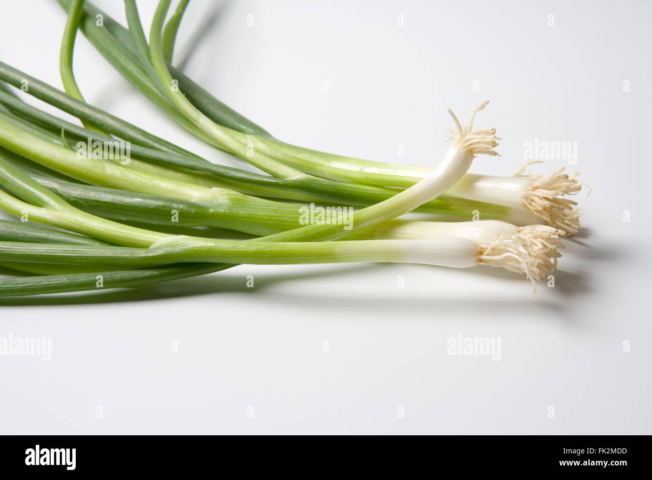 Bunch Of Fresh Spring Onions On White Background Stock Photo - Alamy