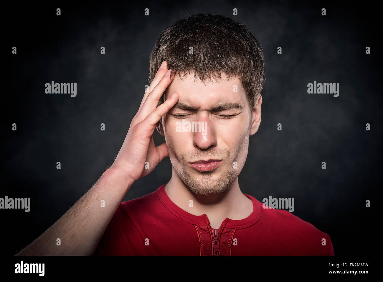 Man feeling a headache or intensely thinking Stock Photo - Alamy