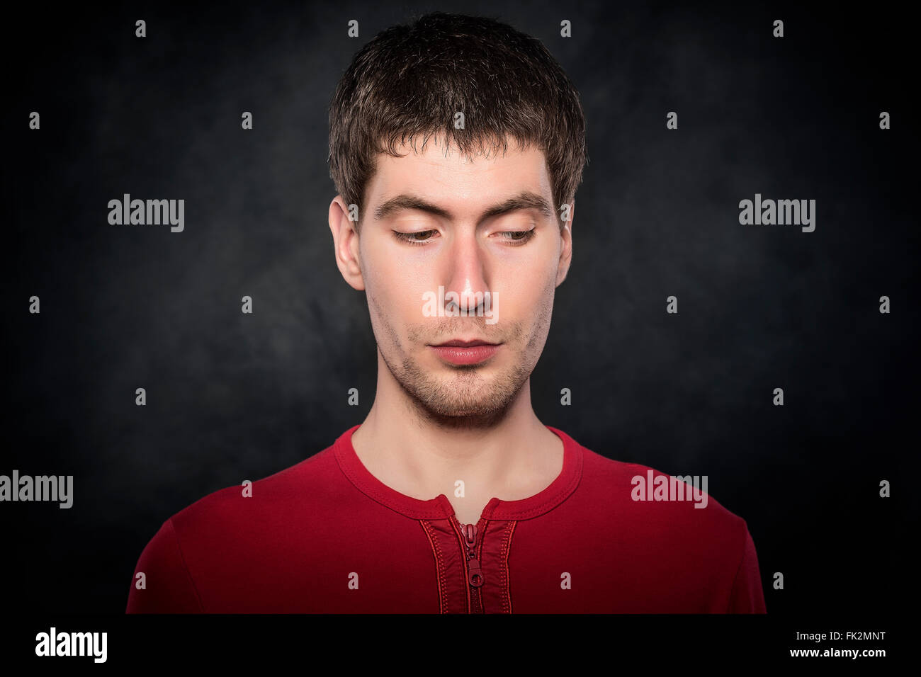 Young man thinking Stock Photo - Alamy