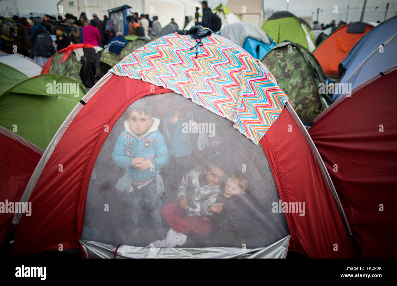 Refugee children in a tent by the border fence in the refugee camp at ...
