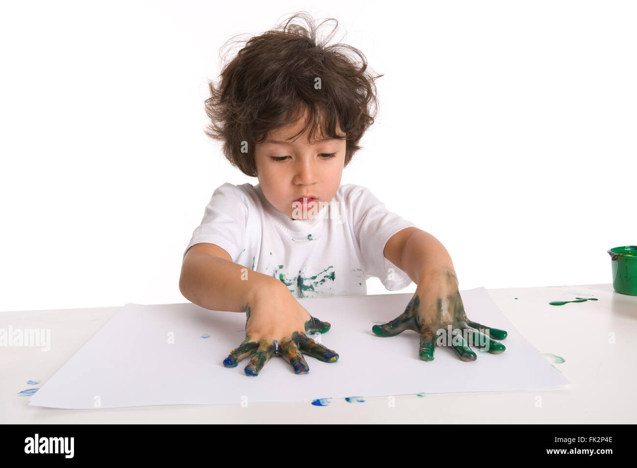 Little Boy Is Making A Finger- Painting on white background Stock Photo ...