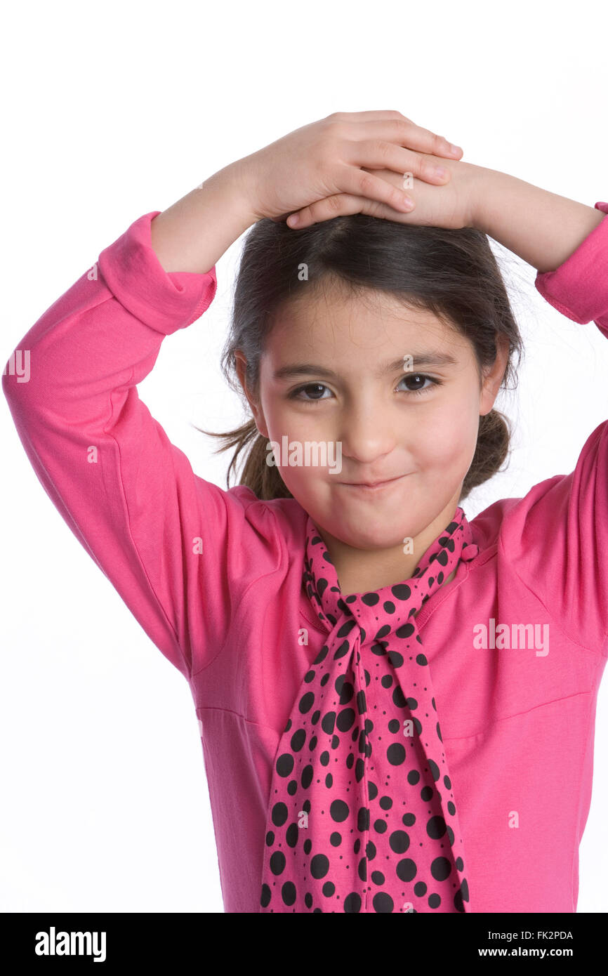 Little Girl Is Looking Into The Camera With A Timid Expression on white ...