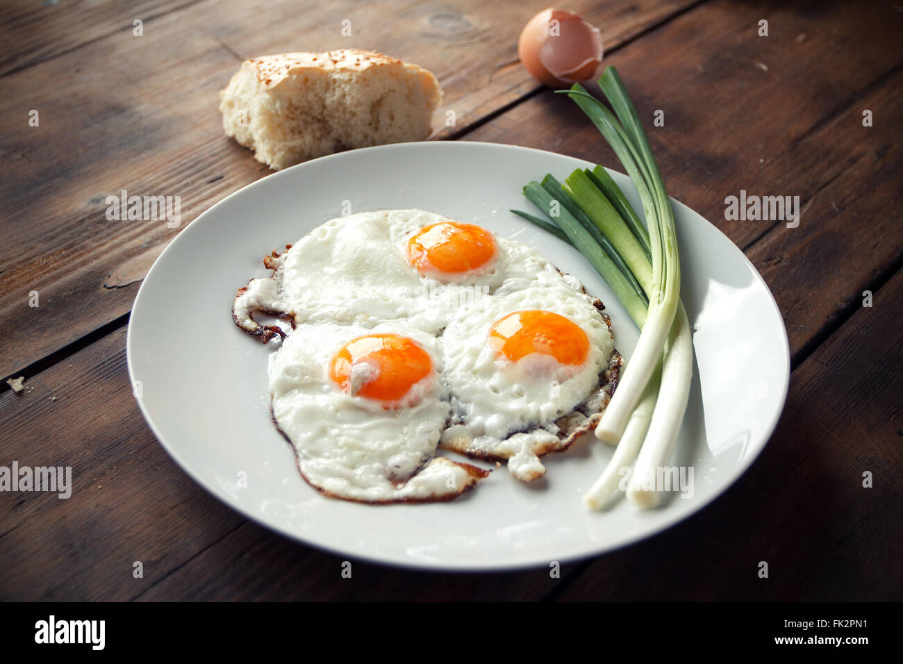 Breakfast with fried eggs and spring onion Stock Photo - Alamy