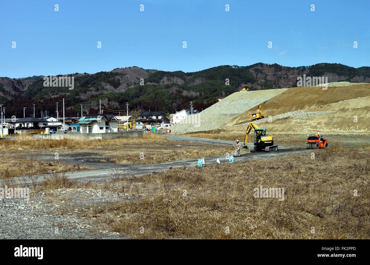 Yamada-machi, Japan. 4th Mar, 2016. A gigantic levee, right, separates ...