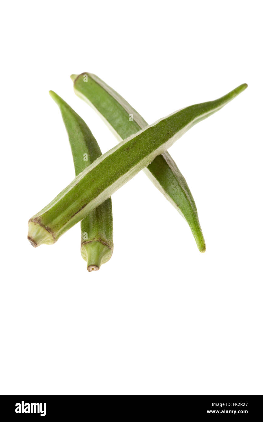 Fresh raw green okras on white background Stock Photo - Alamy