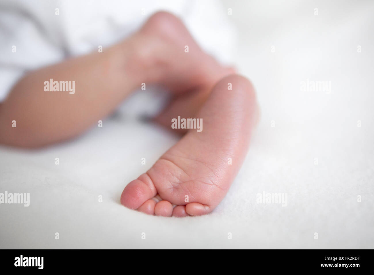 Cute tiny newborn baby feet Stock Photo - Alamy