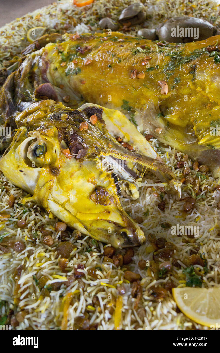 Whole sheep for lunch on a bed of rice Stock Photo - Alamy