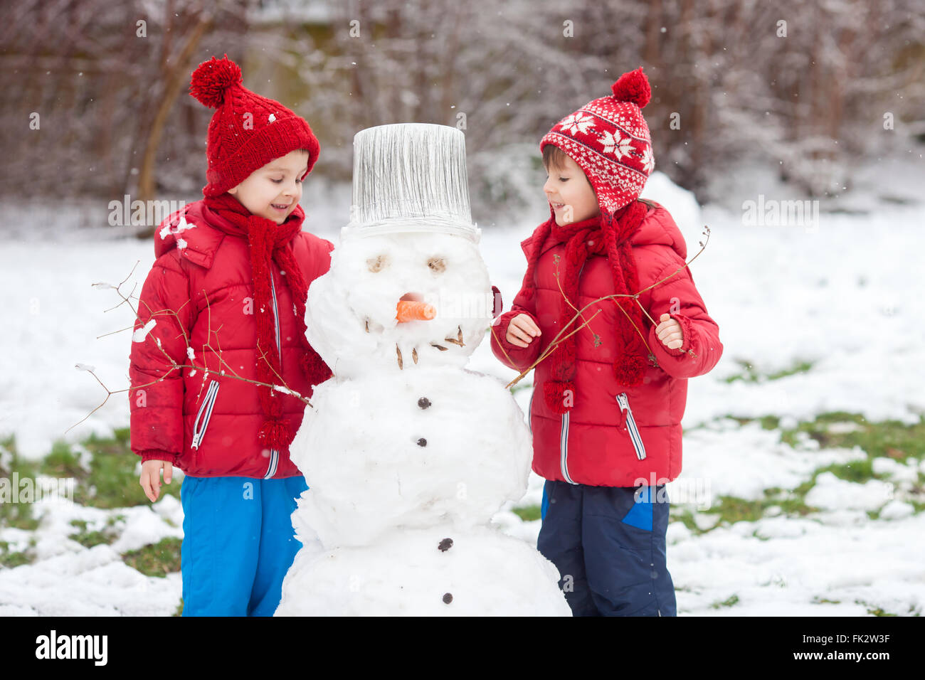 Group young people building snowman hi-res stock photography and images ...