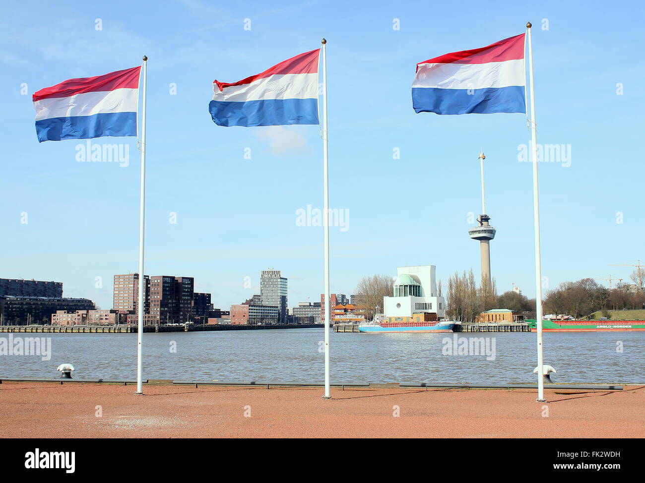 Three Dutch flags flying high, in background 185m high Euromast ...