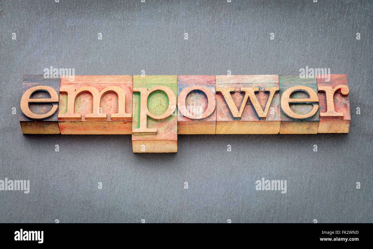 empower word banner in letterpress wood type printing blocks stained by ...