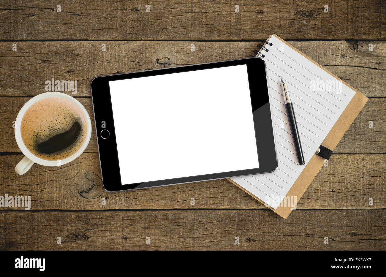 tablet on wood desk on top view Stock Photo - Alamy