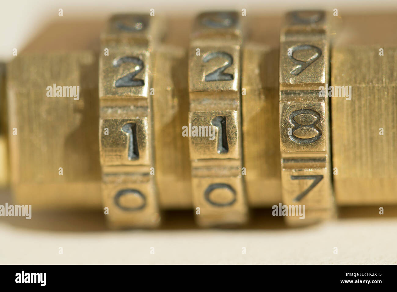 combination key of a security padlock of brass Stock Photo - Alamy