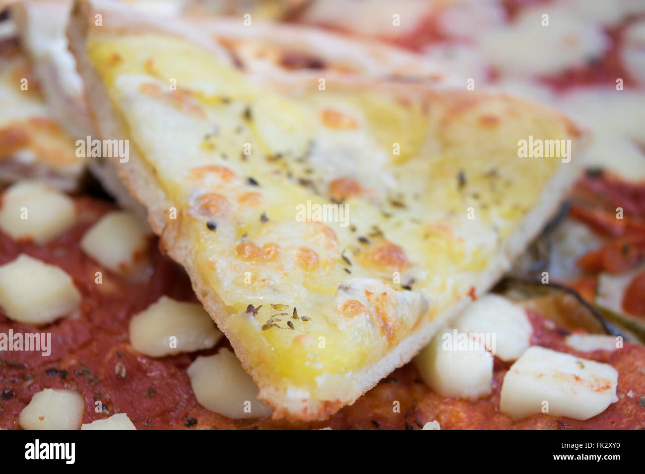 wedge of home made pizza with mozzarella and potatoes Stock Photo - Alamy