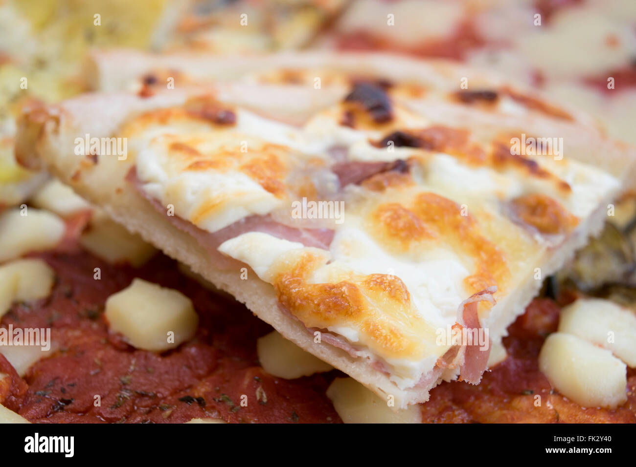 wedge of home made pizza with mozzarella and cured ham Stock Photo - Alamy