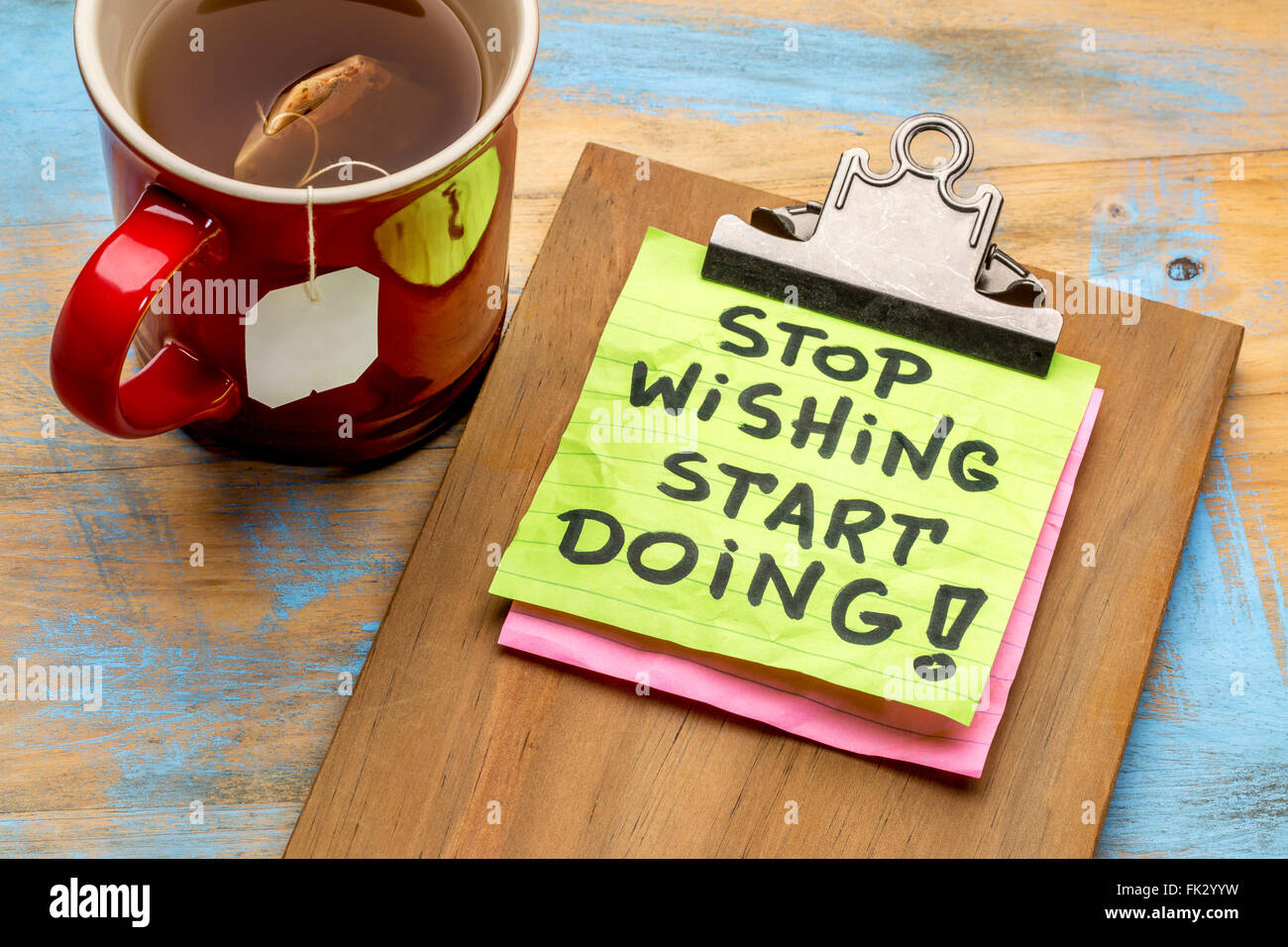 stop wishing, start doing motivational - a sticky note on a clipboard ...