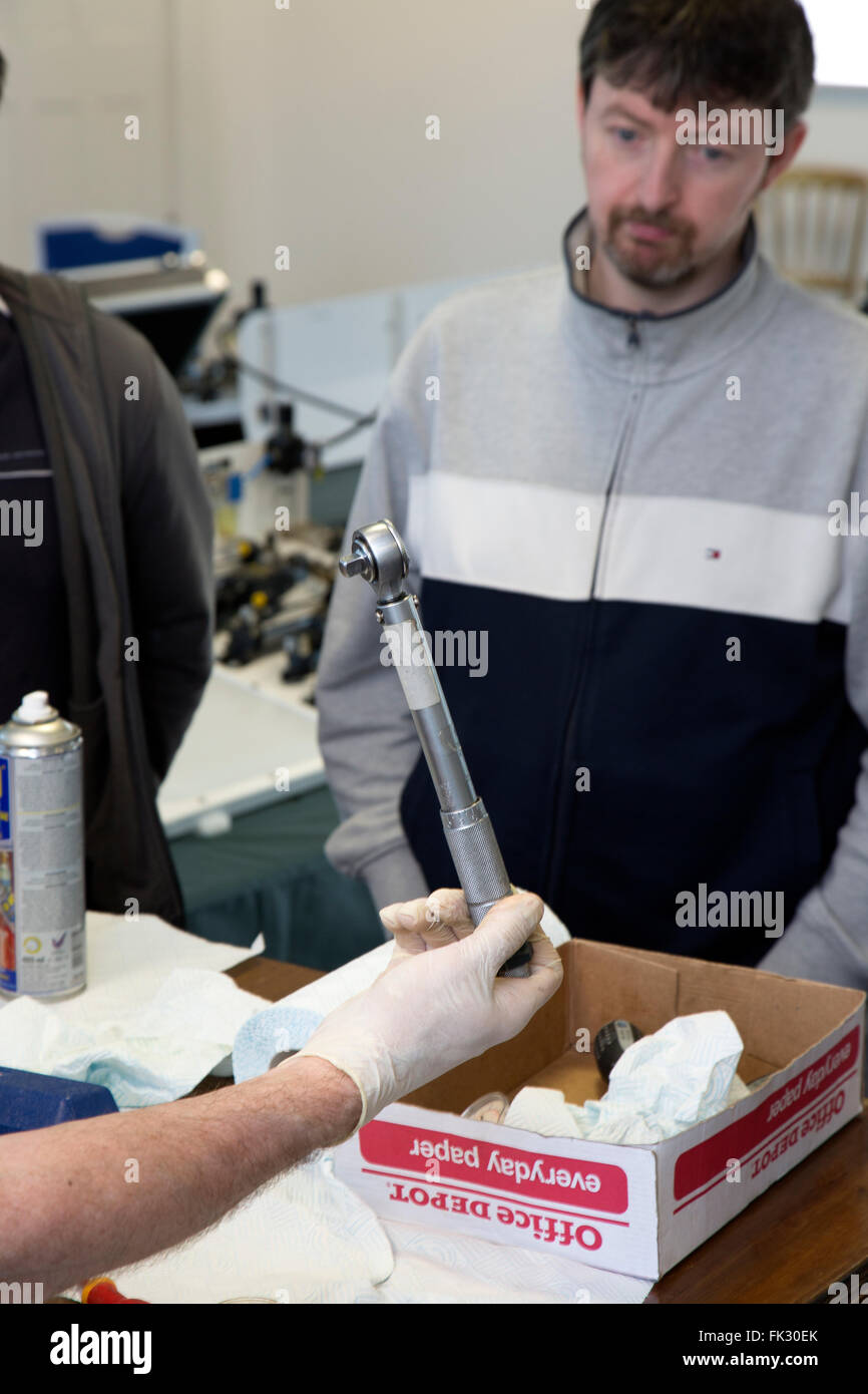 Engineering instructor wearing rubber gloves and holding tool Stock ...