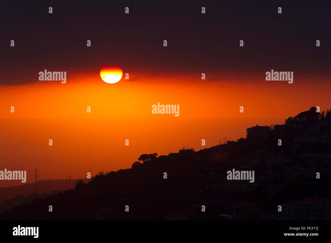 Beirut Lebanon. 6th March 2016. A dramatic sunset against silhouetted ...