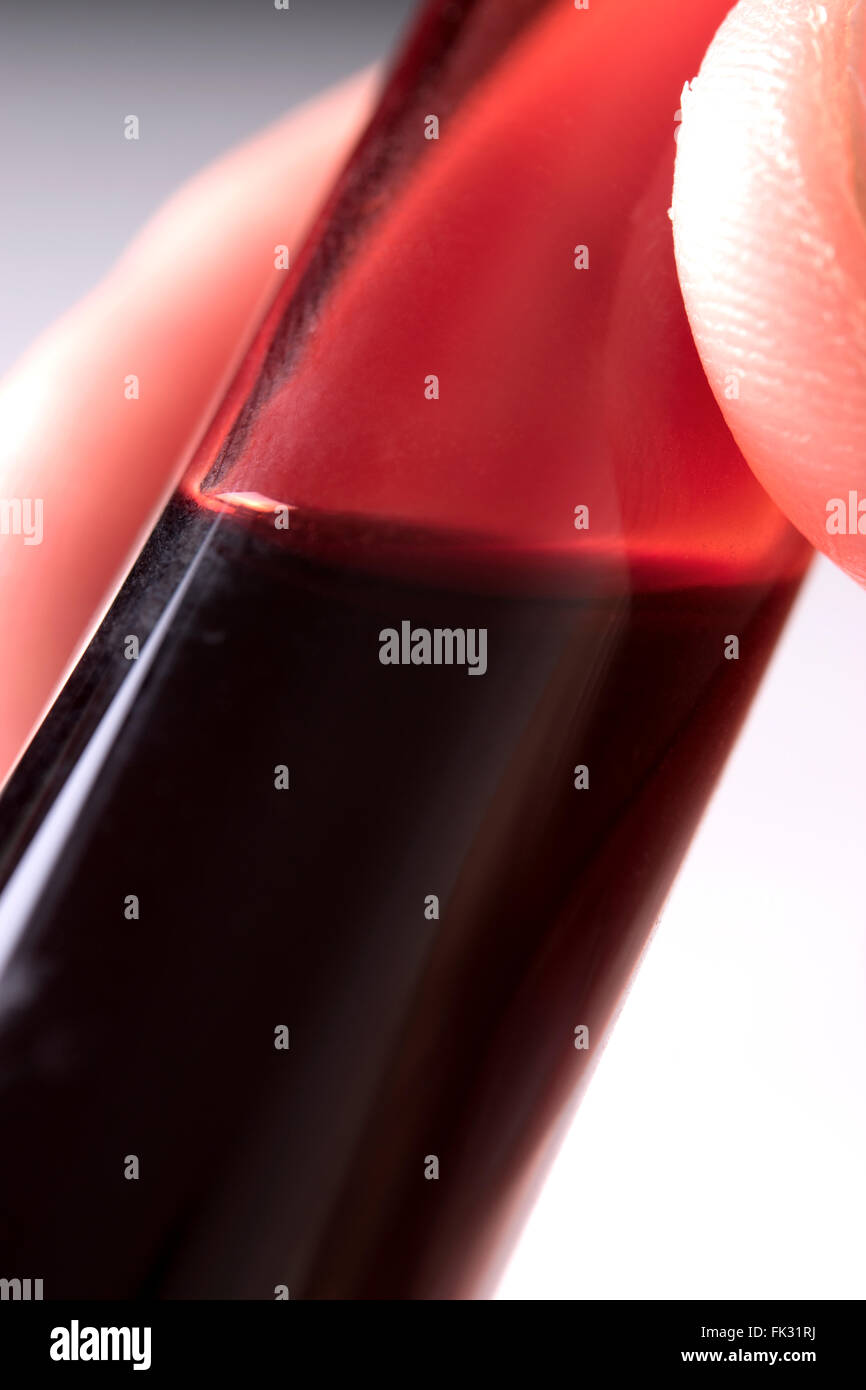 close up of blood spilling from test tube Stock Photo - Alamy