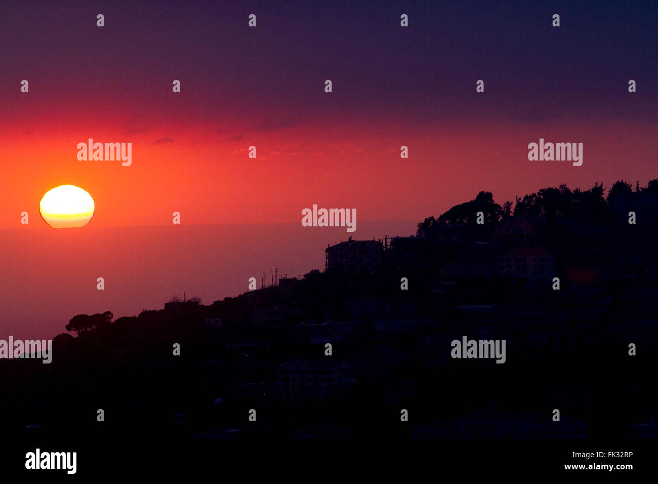 Beirut Lebanon. 6th March 2016. A dramatic sunset against silhouetted ...