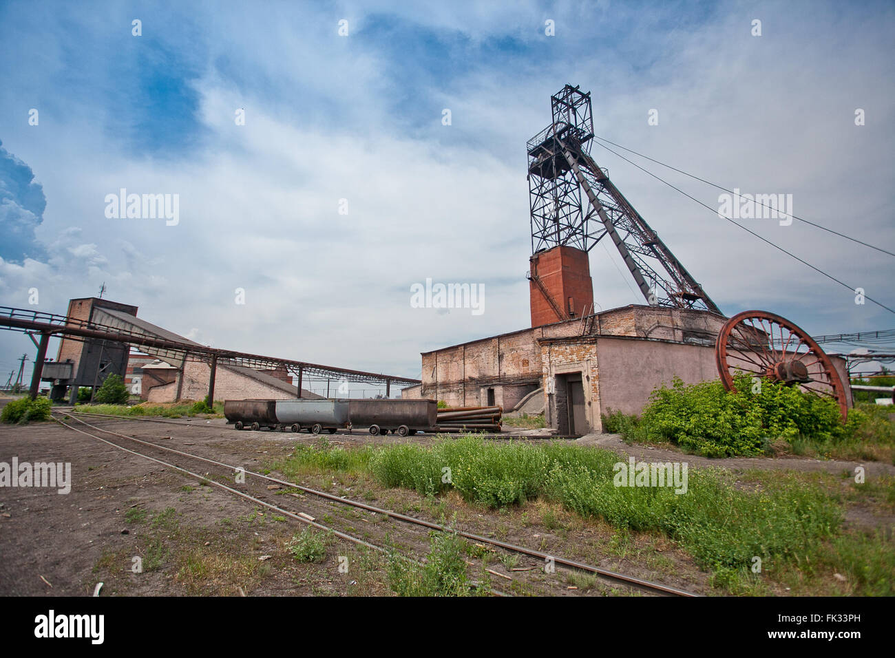 Coal mine tower on blue sky Stock Photo - Alamy