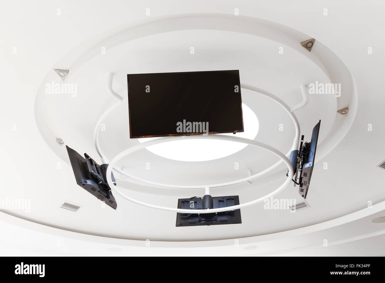 abstract interior background with led tv, four televisions hanging from ...