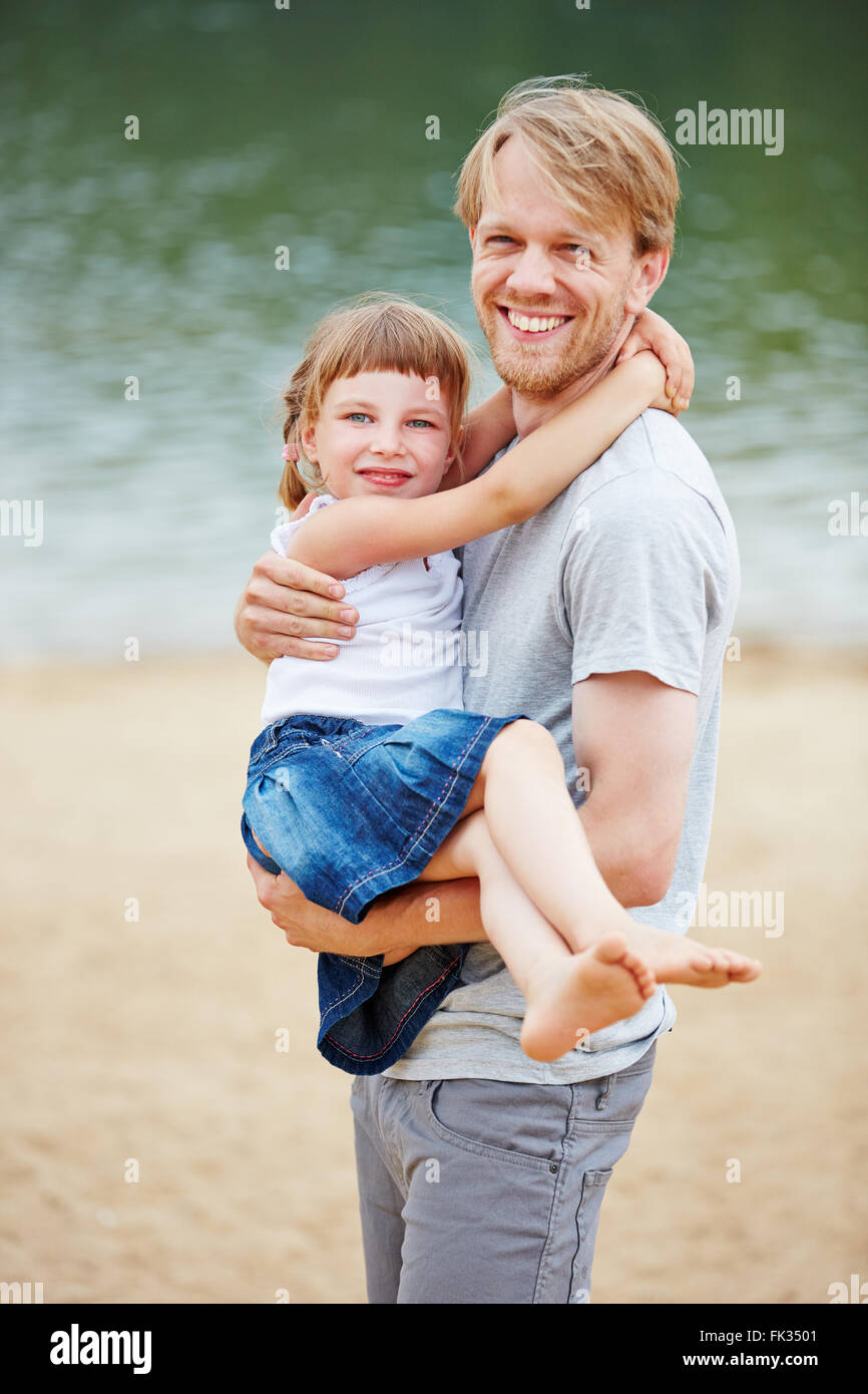 Father carrying his daughter hi-res stock photography and images - Alamy