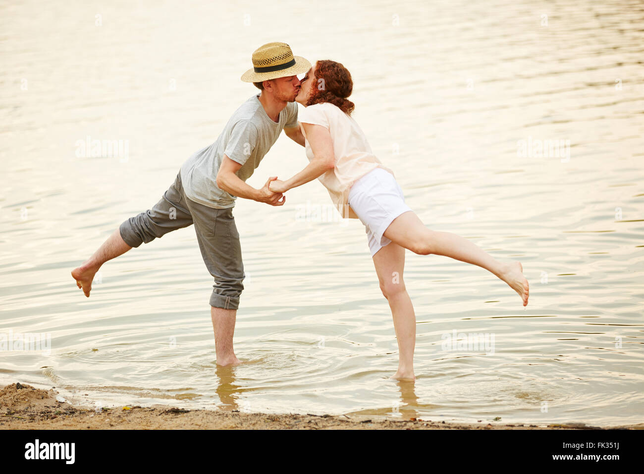Couple kissing in water hi-res stock photography and images - Alamy