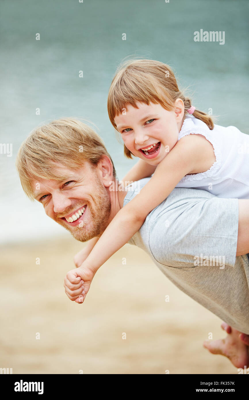 Child on piggyback hi-res stock photography and images - Alamy