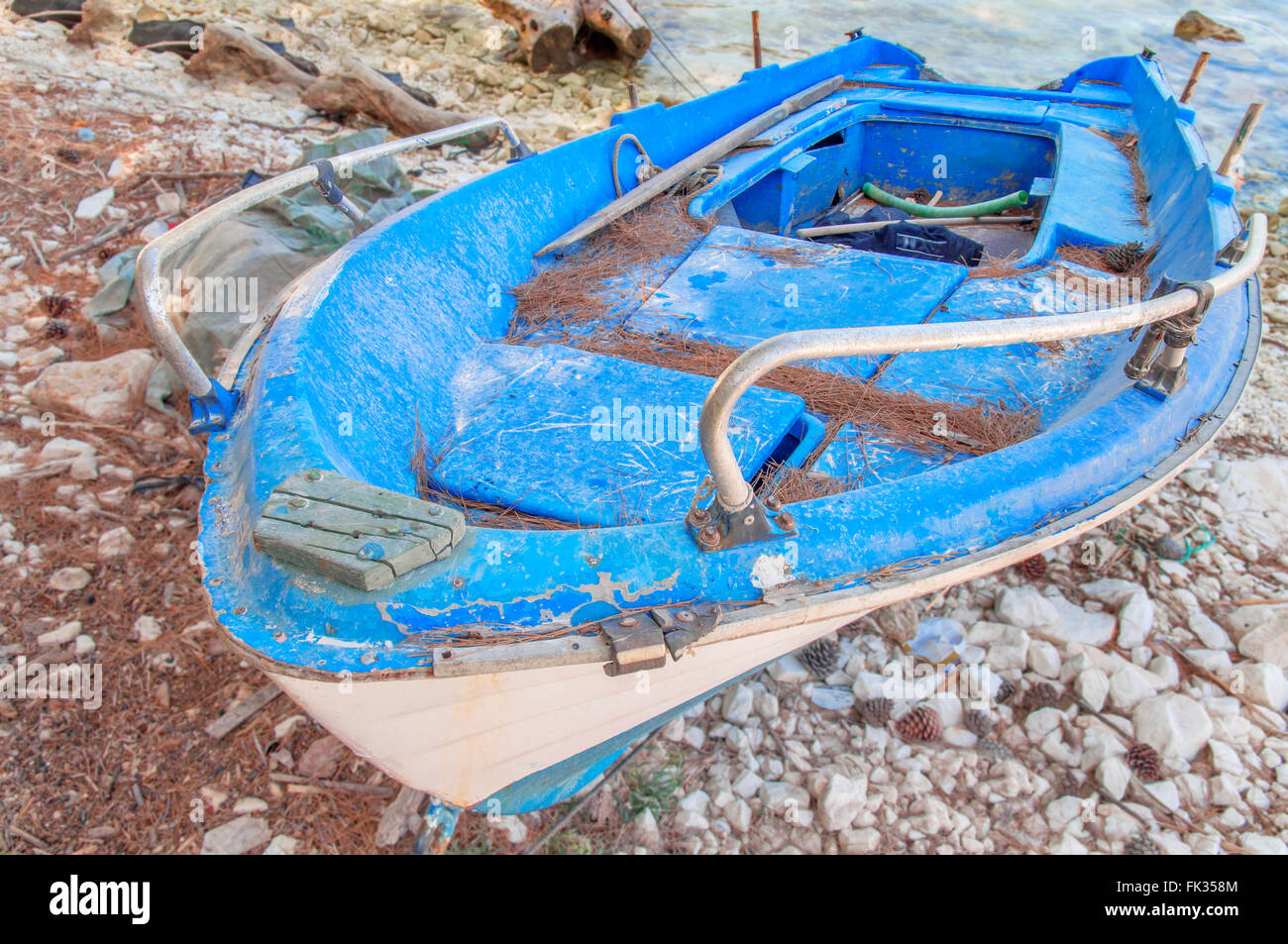 Old blue metal shabby fishing boat Stock Photo - Alamy