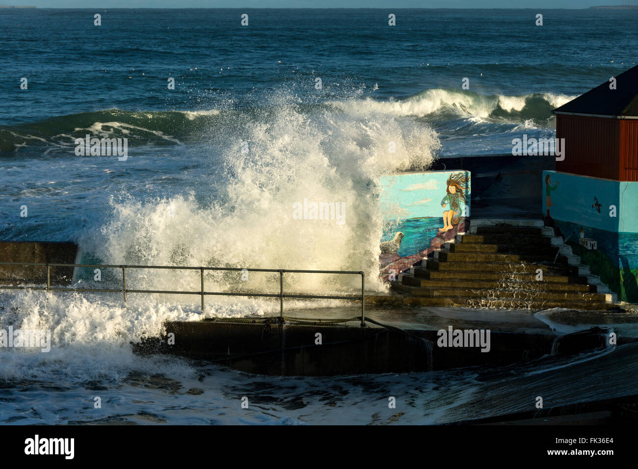 Large wave crashing over the harbour wall at John o'Groats, Caithness ...