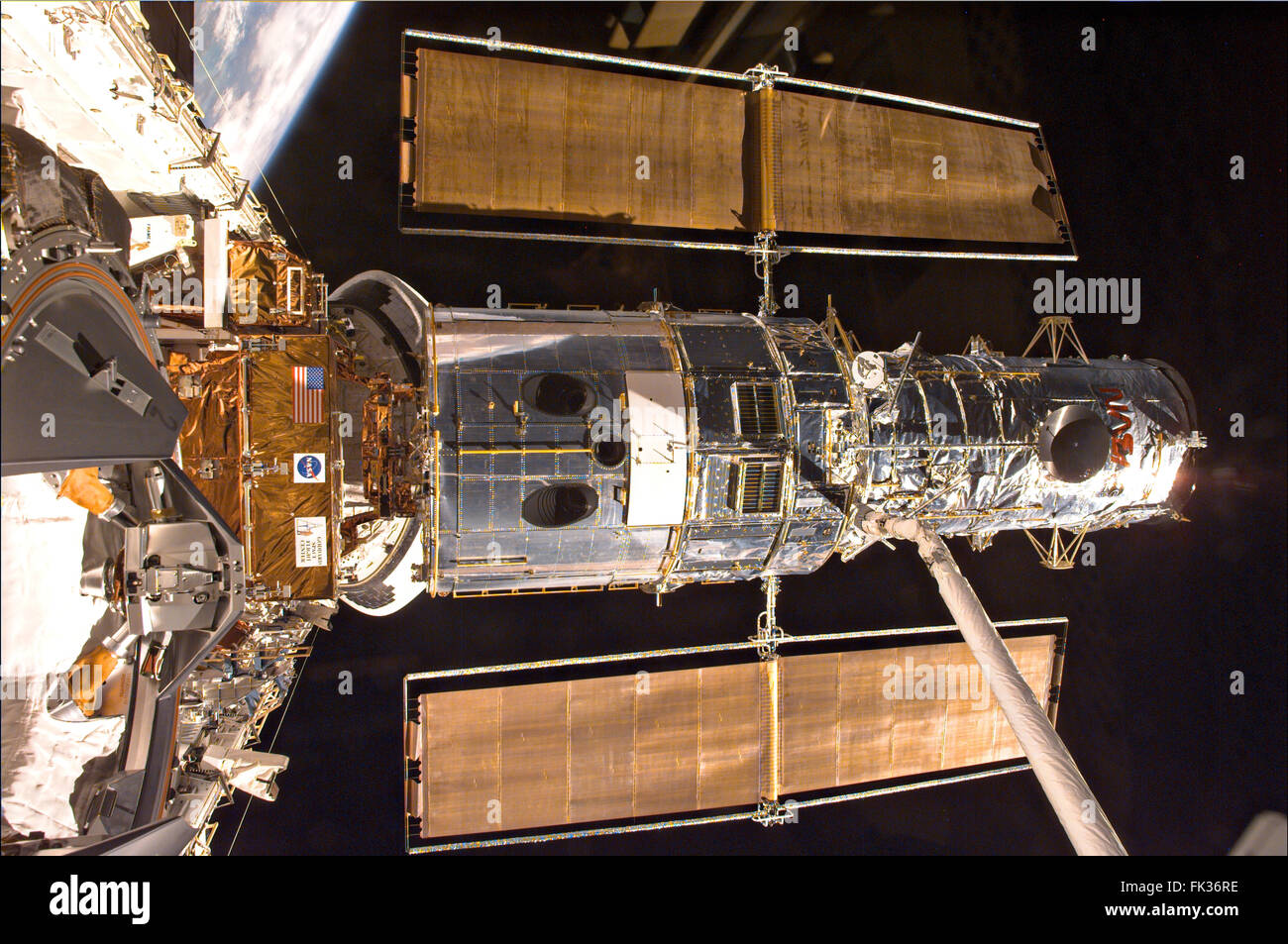 The Hubble Space Telescope berthed in the Space Shuttle Discovery cargo ...