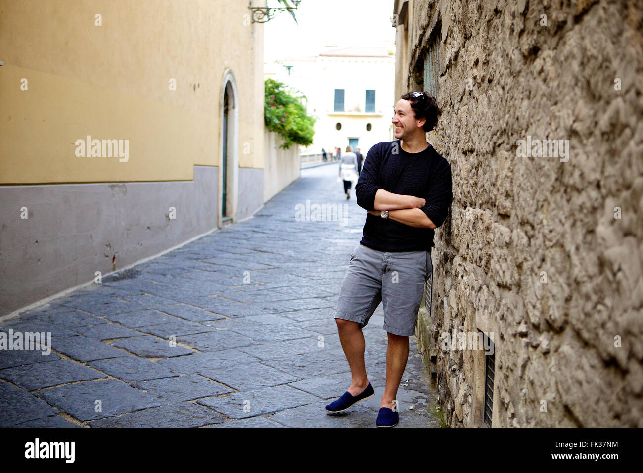 Boy leaning against door hi-res stock photography and images - Alamy