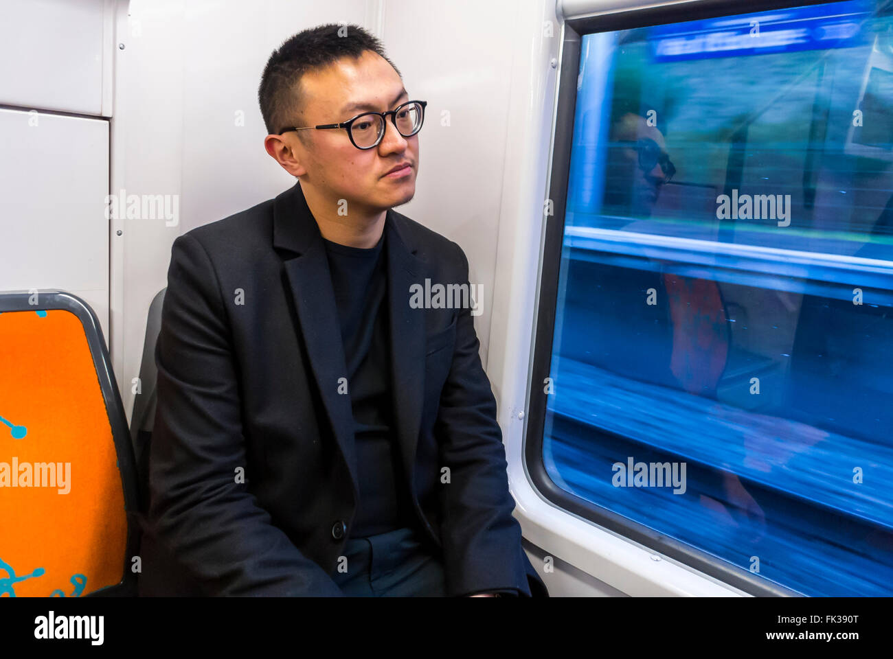 Man on tube train hi-res stock photography and images - Alamy