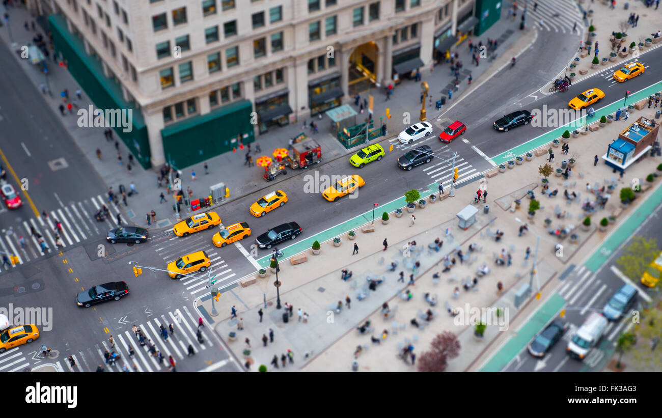 Traffic and pedestrians pass through the Madison Square intersection of ...