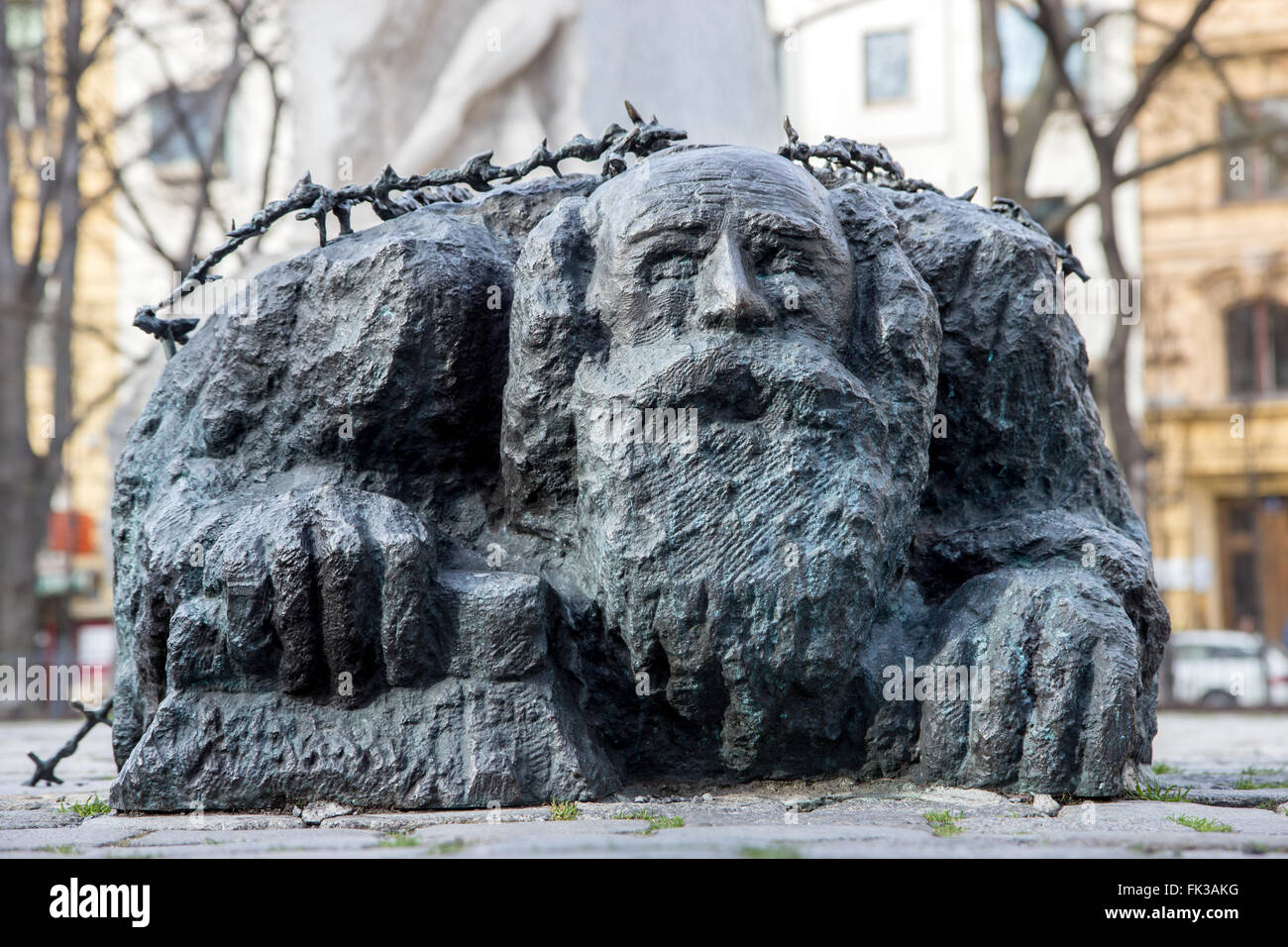 Statue of kneeling Jew, located at the base of the Monument against War ...