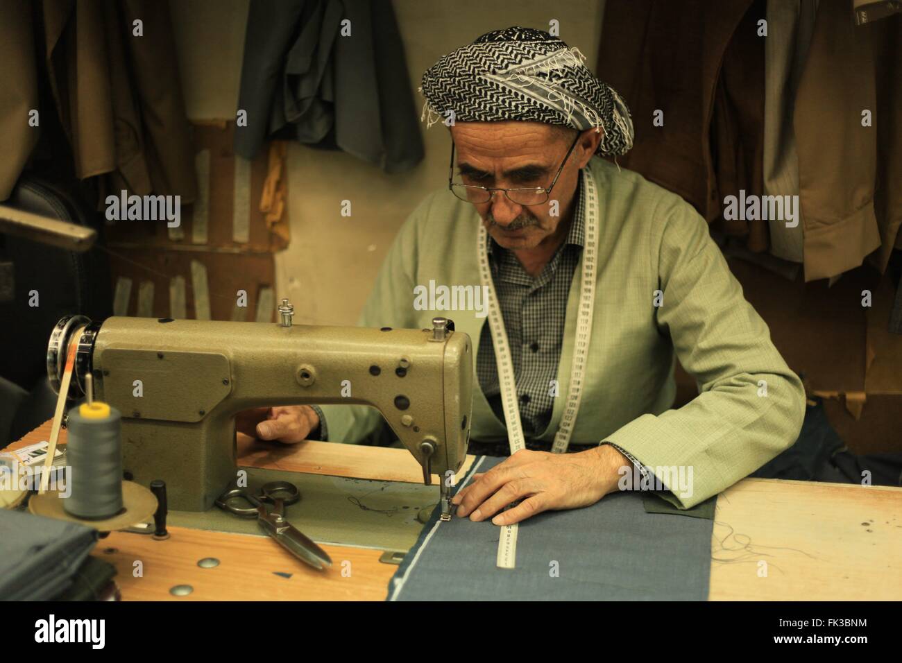 A Kurdish tailor in his workshop at Erbil bazaar Stock Photo - Alamy