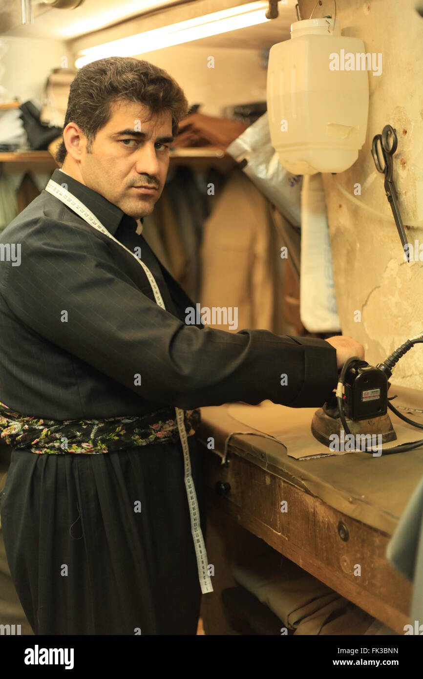 A Kurdish tailor in his workshop at Erbil bazaar Stock Photo - Alamy