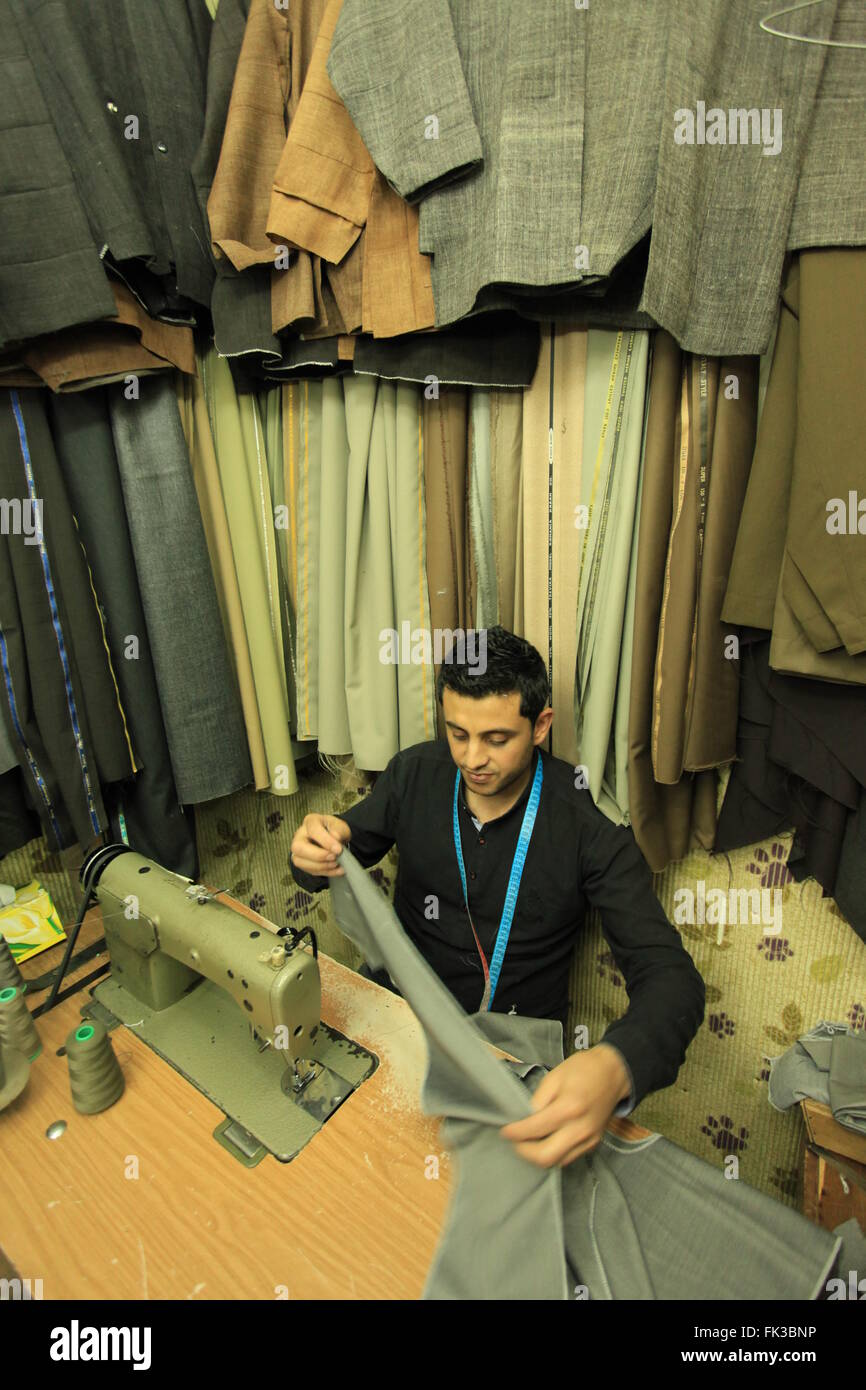 A Kurdish tailor in his workshop at Erbil bazaar Stock Photo - Alamy