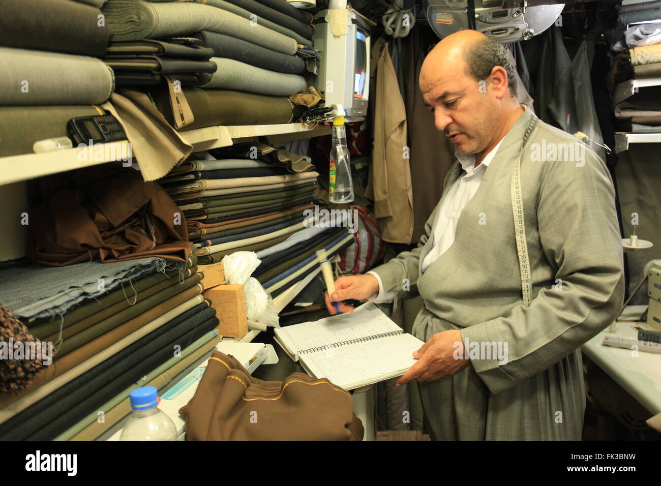 A Kurdish tailor in his workshop at Erbil bazaar Stock Photo - Alamy