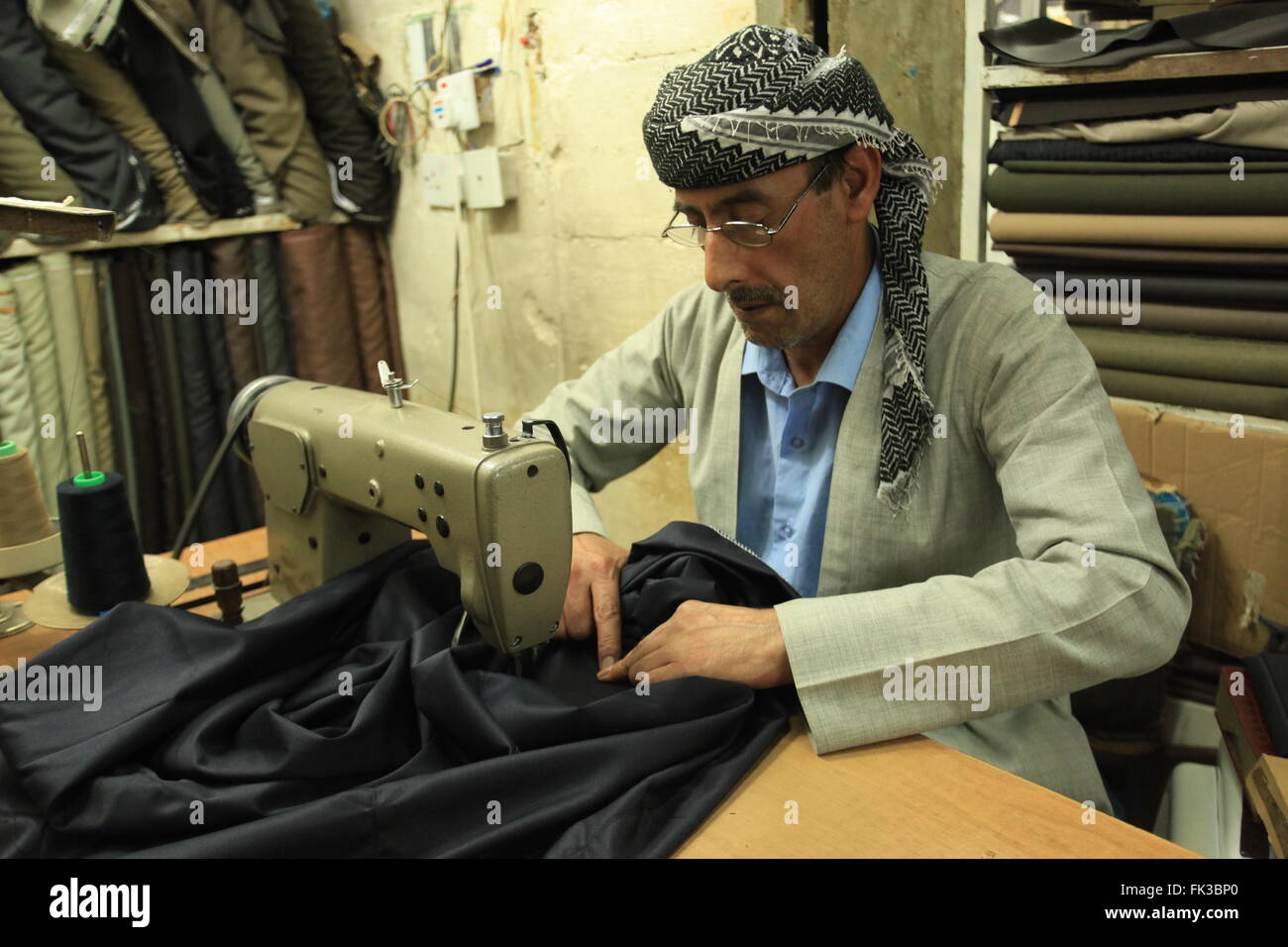 A Kurdish tailor in his workshop at Erbil bazaar Stock Photo - Alamy