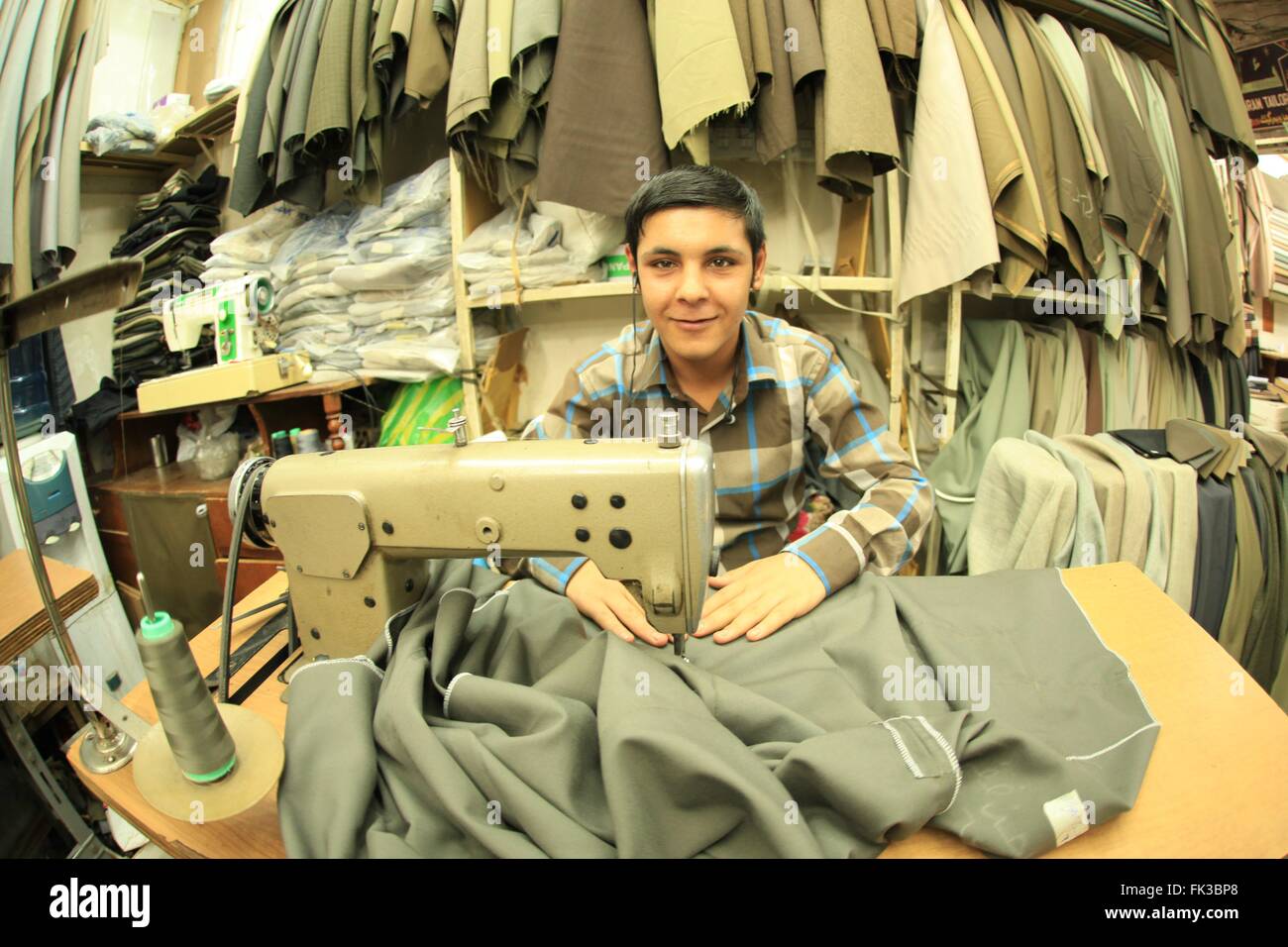A young Kurdish tailor in his workshop at Erbil bazaar Stock Photo - Alamy