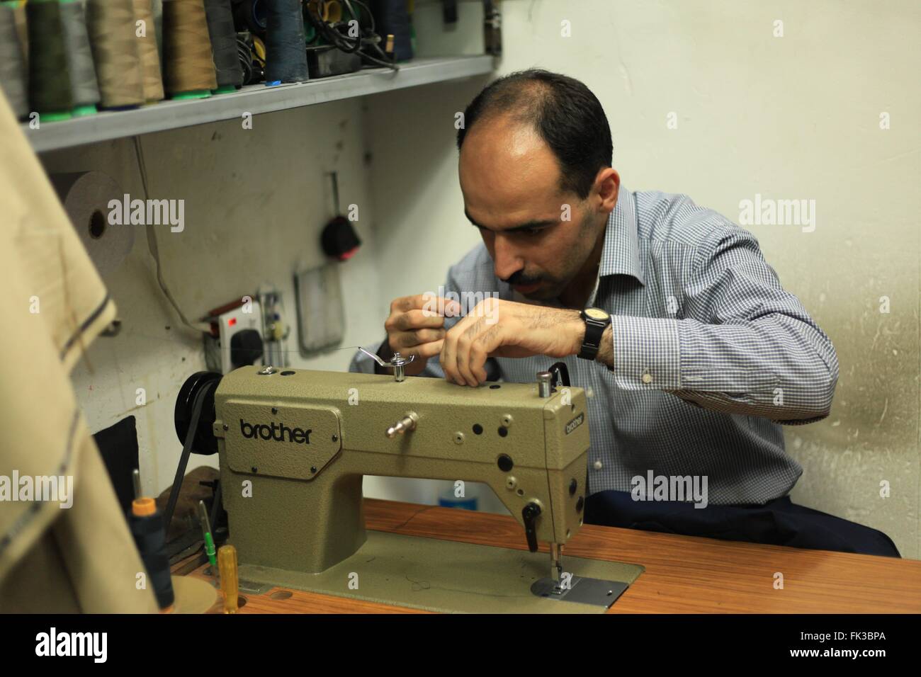 A Kurdish tailor in his workshop at Erbil bazaar Stock Photo - Alamy