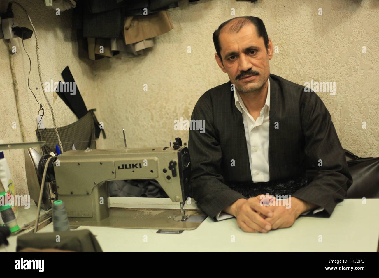 A Kurdish tailor in his workshop at Erbil bazaar Stock Photo - Alamy