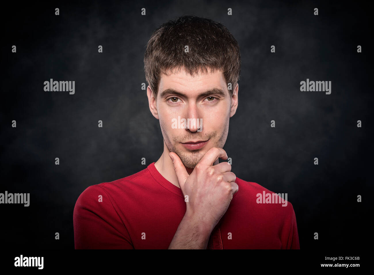 Young man thinking Stock Photo - Alamy