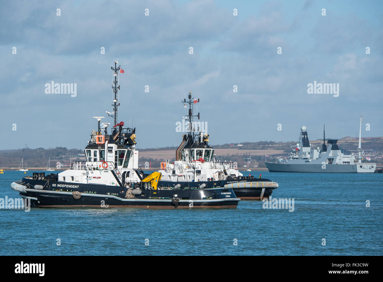 Tugs awaiting their next customer Stock Photo - Alamy
