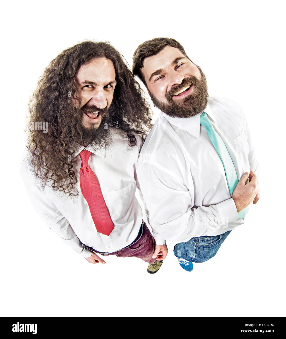 Two laughing nerds posing in bright office's room Stock Photo - Alamy