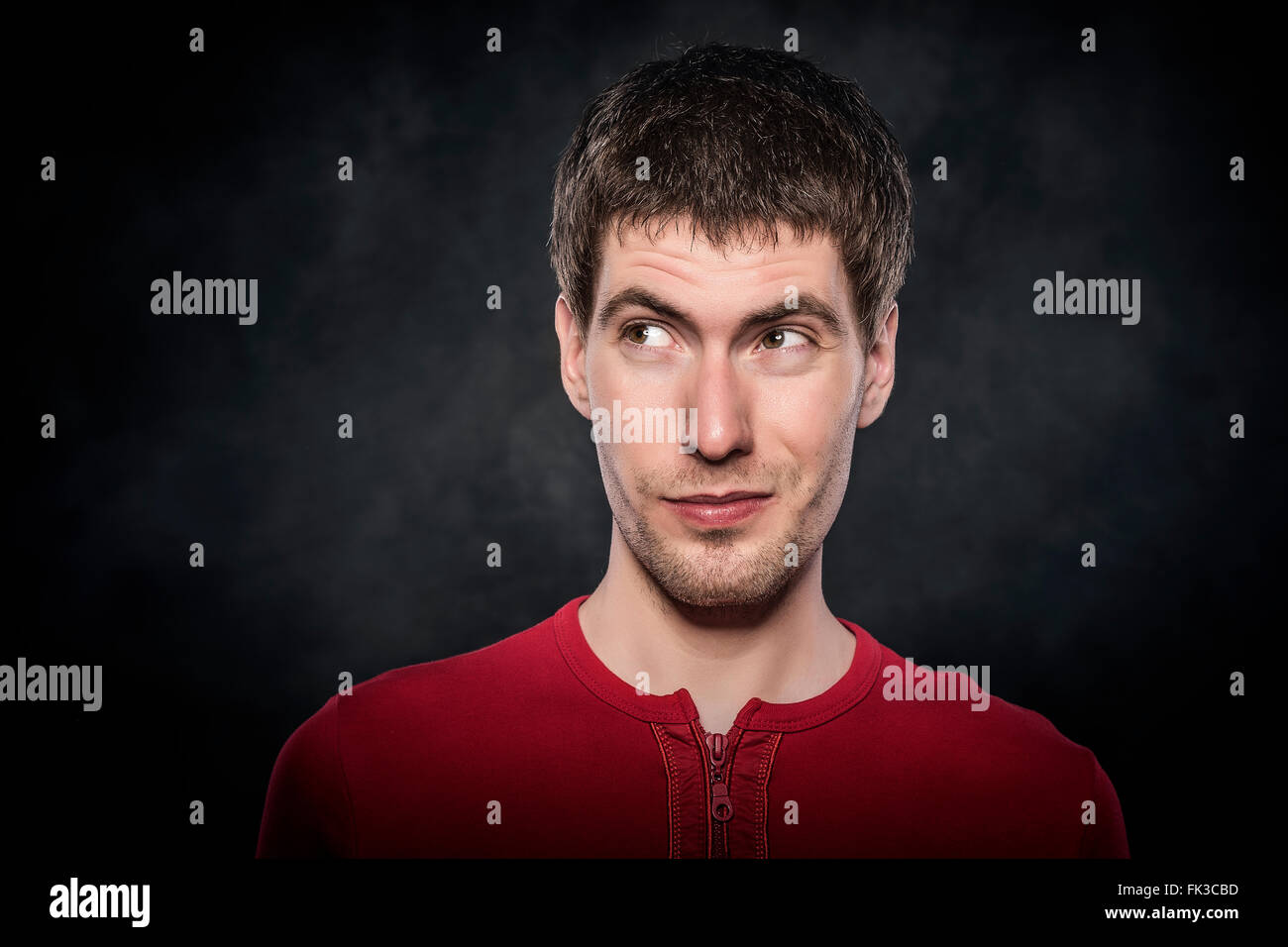 Young man thinking Stock Photo - Alamy